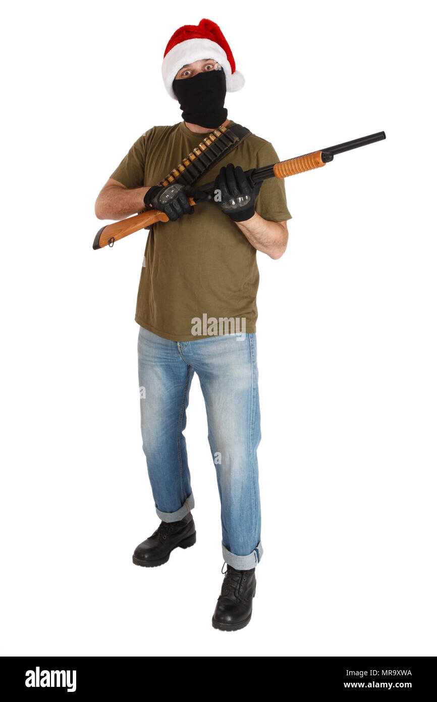 robber in a cap of Santa Claus with shotgun isolated Stock Photo - Alamy
