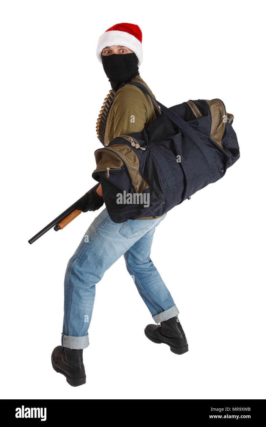 robber in a cap of Santa Claus with shotgun isolated Stock Photo - Alamy