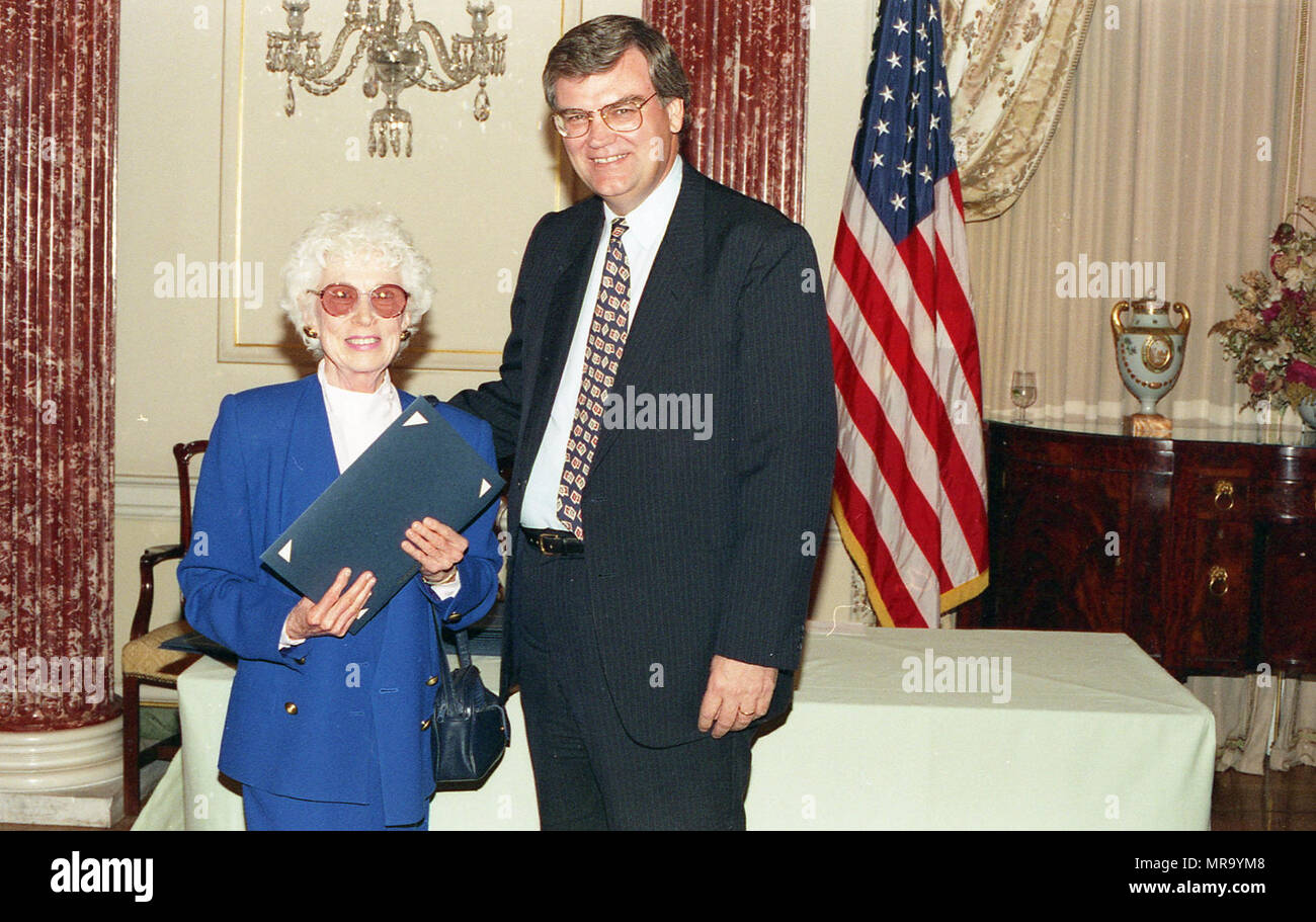 woman accepting award taking a picture Stock Photo - Alamy