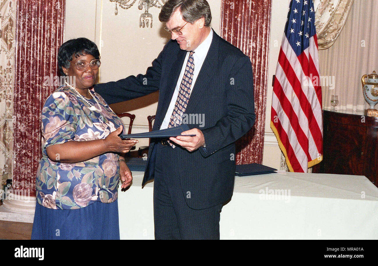 woman accepting award taking a picture Stock Photo - Alamy