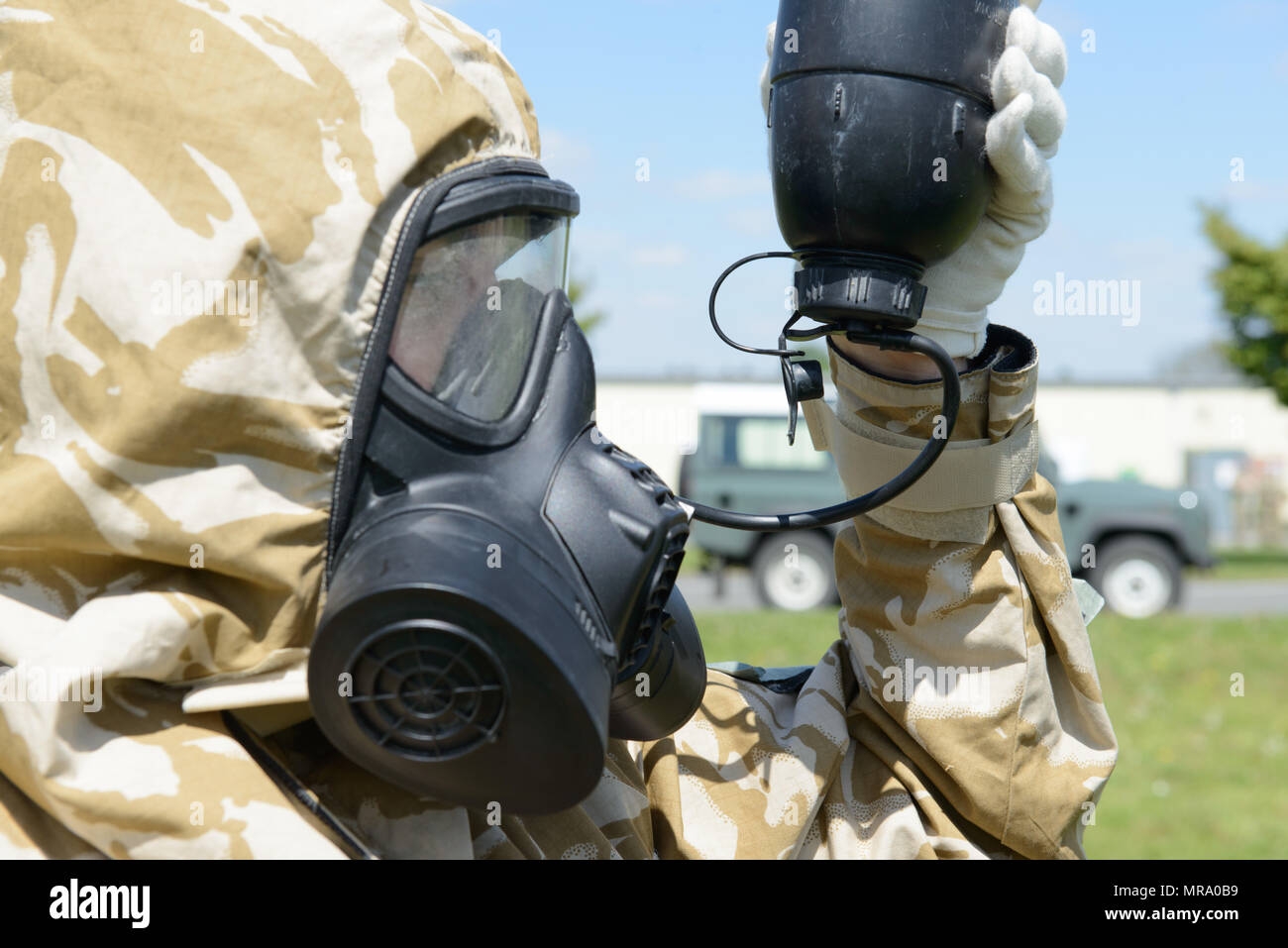 A member of the British Armed Forces assigned to a local unit, performs ...