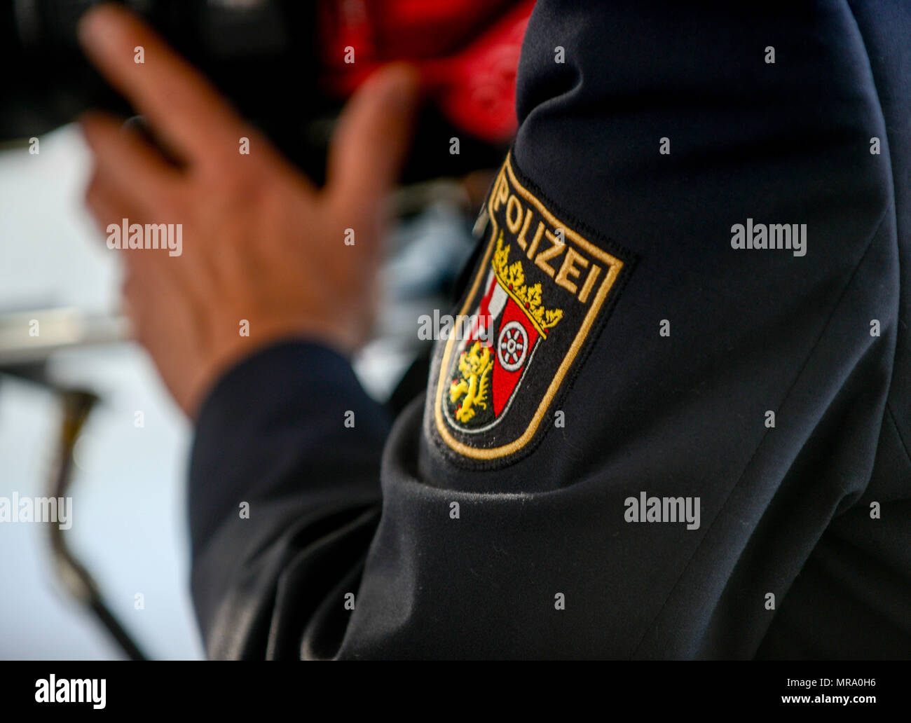 The Polizei shield is displayed on the arm of a Rhineland-Palatinate ...