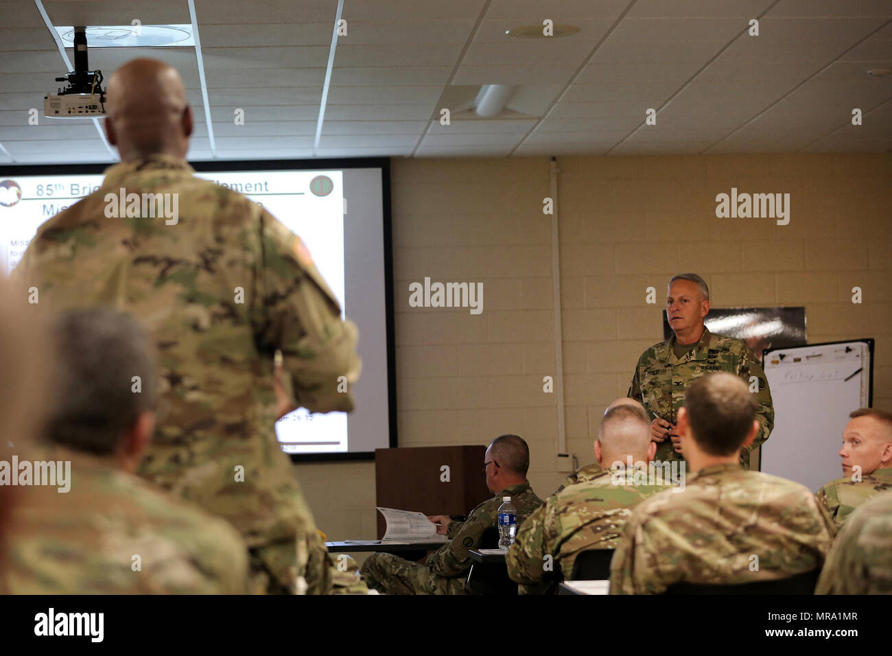 Col. Robert Cooley, right, 85th Support Command deputy commander, talks ...