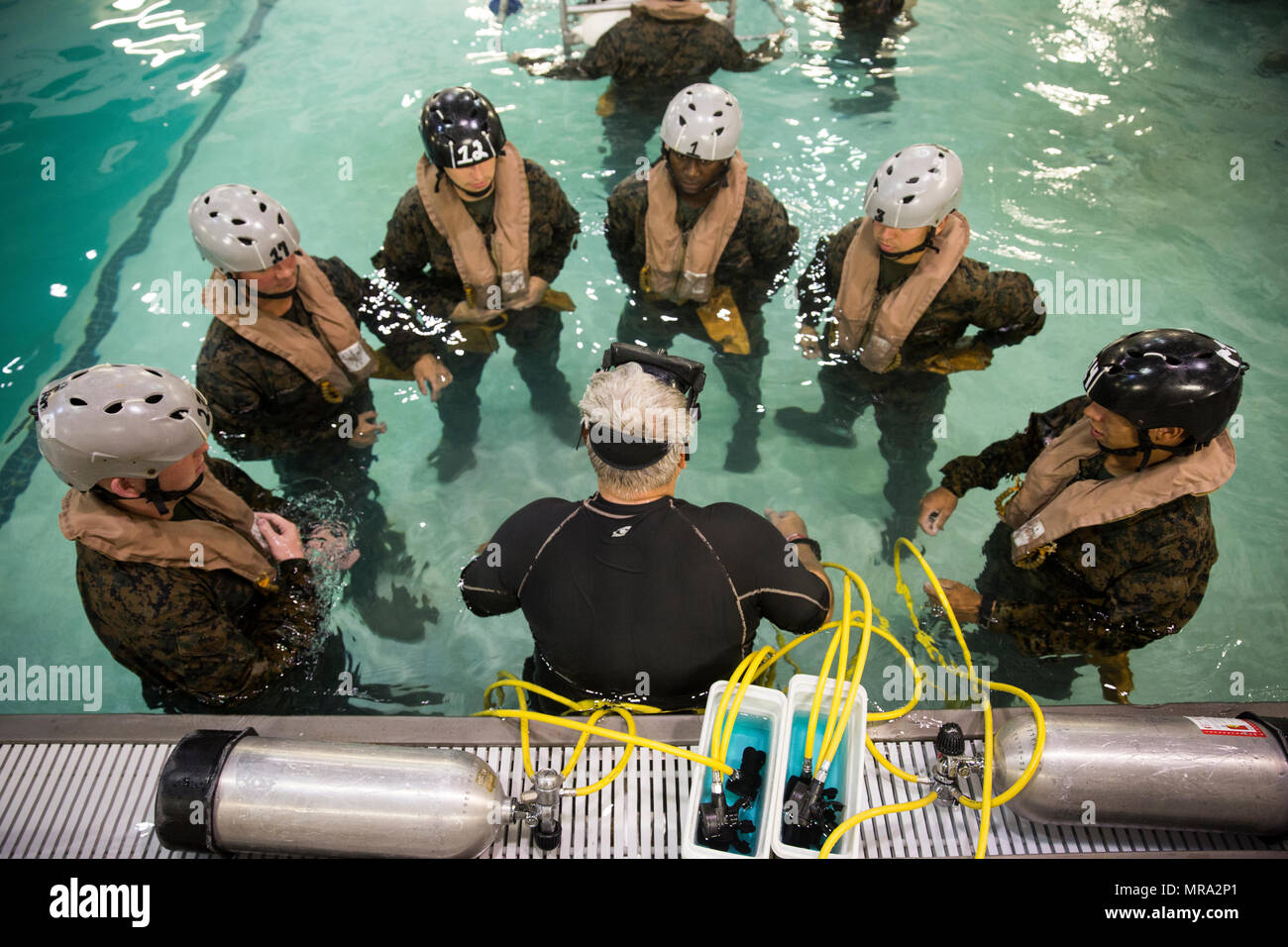 Marines receive instruction for preparing to breathe compressed air out ...