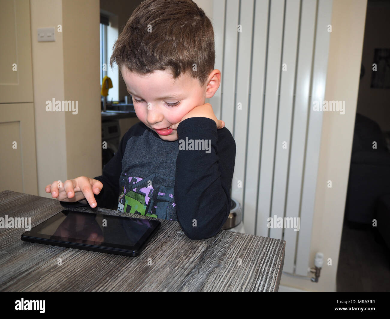 Young child searching the internet Stock Photo - Alamy