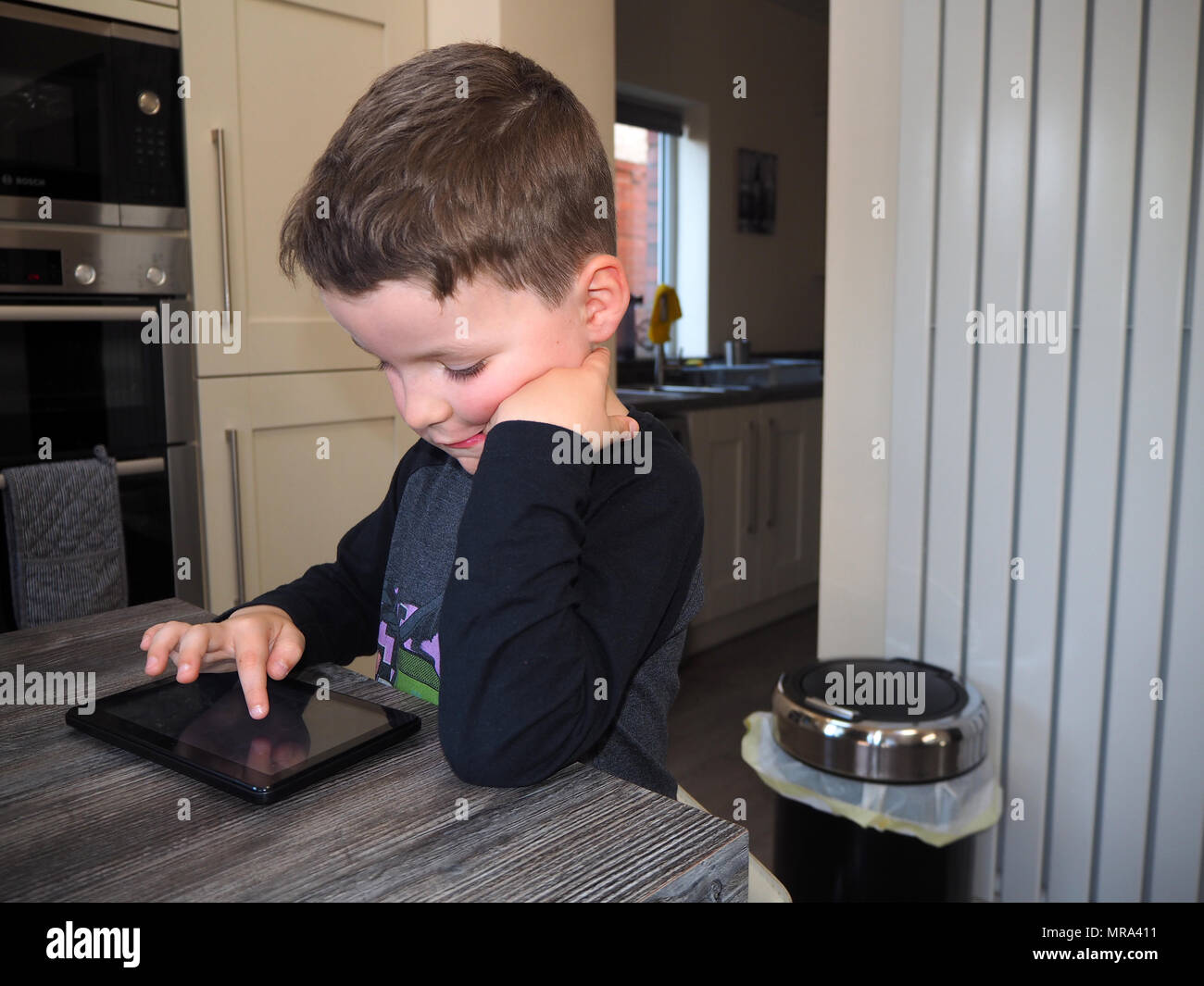 Young child searching the internet Stock Photo - Alamy