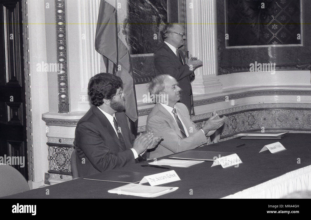 THREE MEN ARE CLAPPING THERE HANDS Stock Photo - Alamy