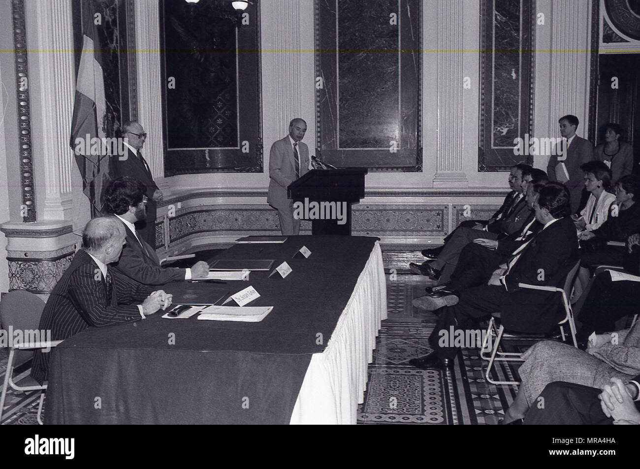A MAN AT THE PODIUM GIVING A SPEECH TO A GROUP OF PEOPLE Stock Photo ...