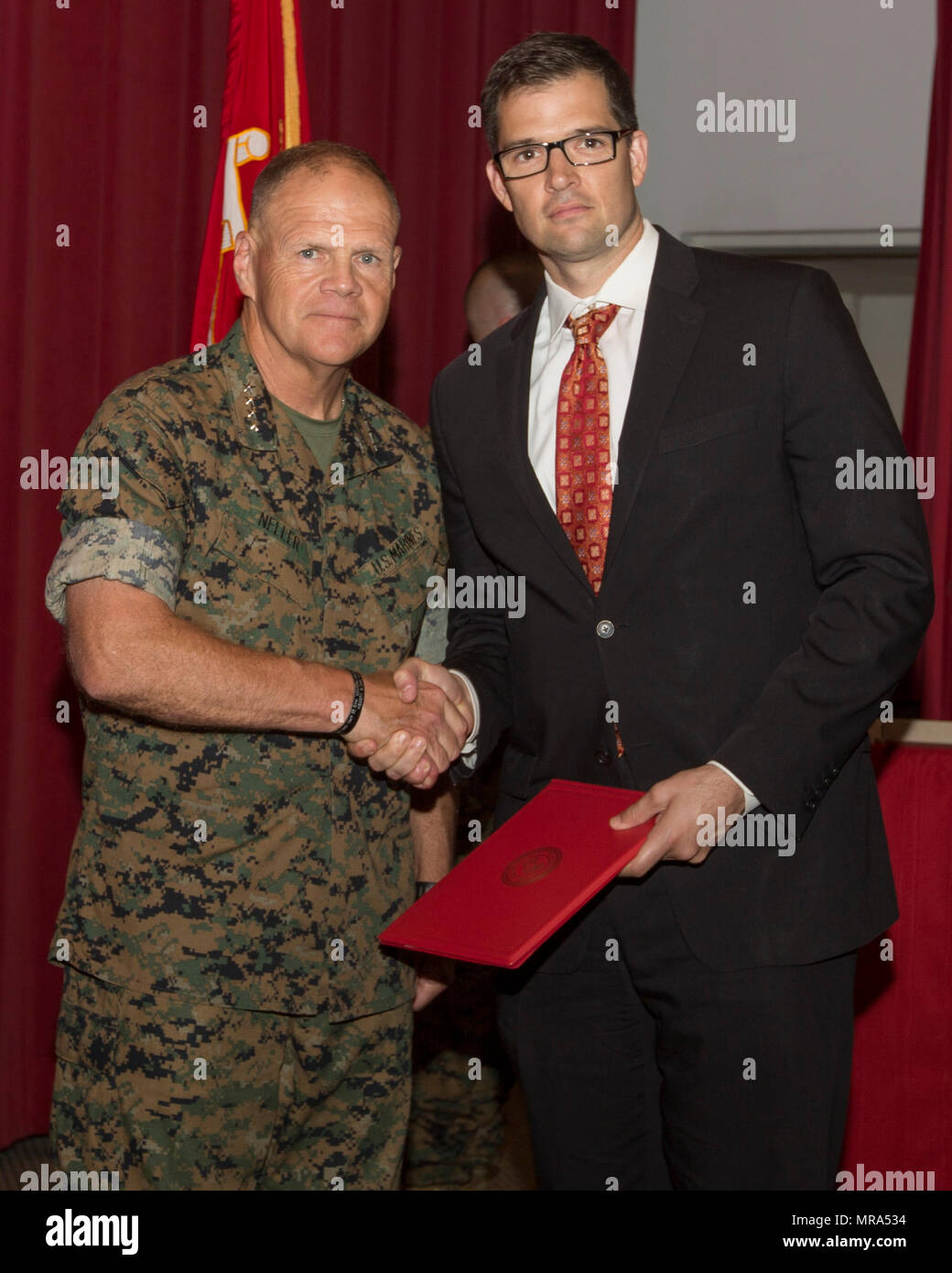 Commandant of the Marine Corps Gen. Robert B. Neller, left, shakes ...