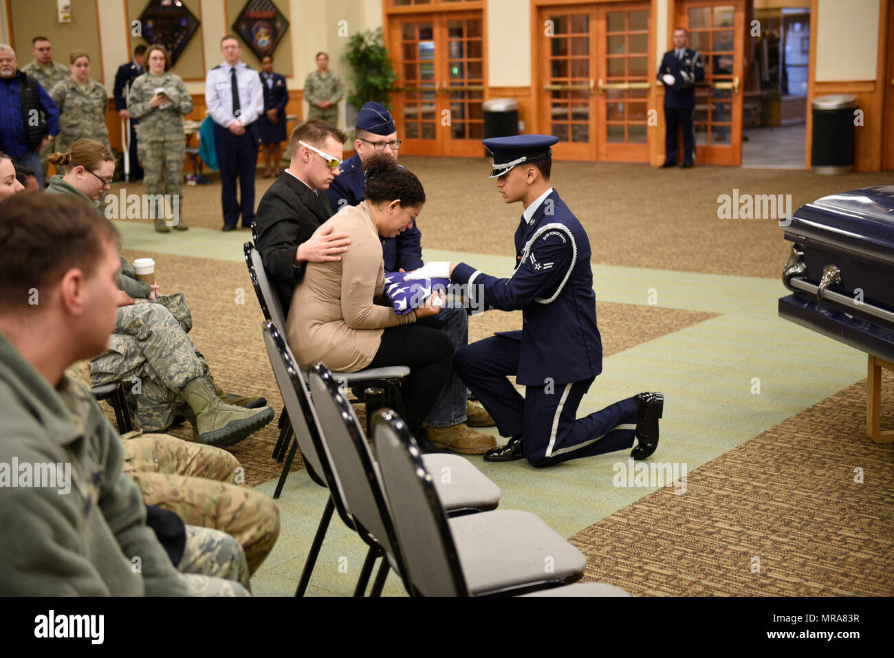 A Malmstrom Honor Guard member presents the American flag to Senior ...