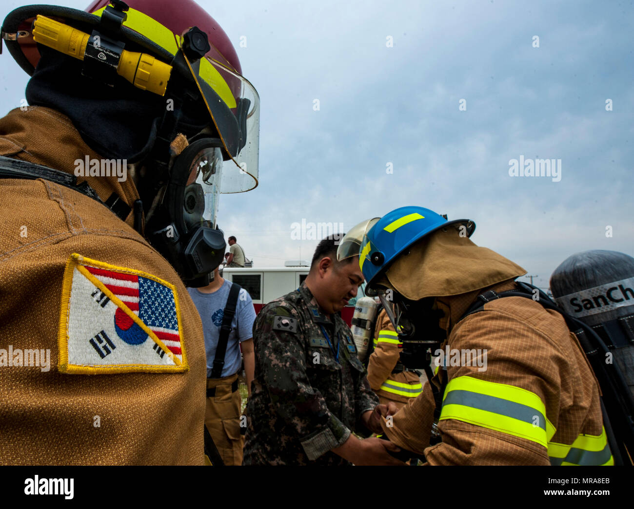 Republic of Korea Air Force firefighters, perform buddy checks while ...
