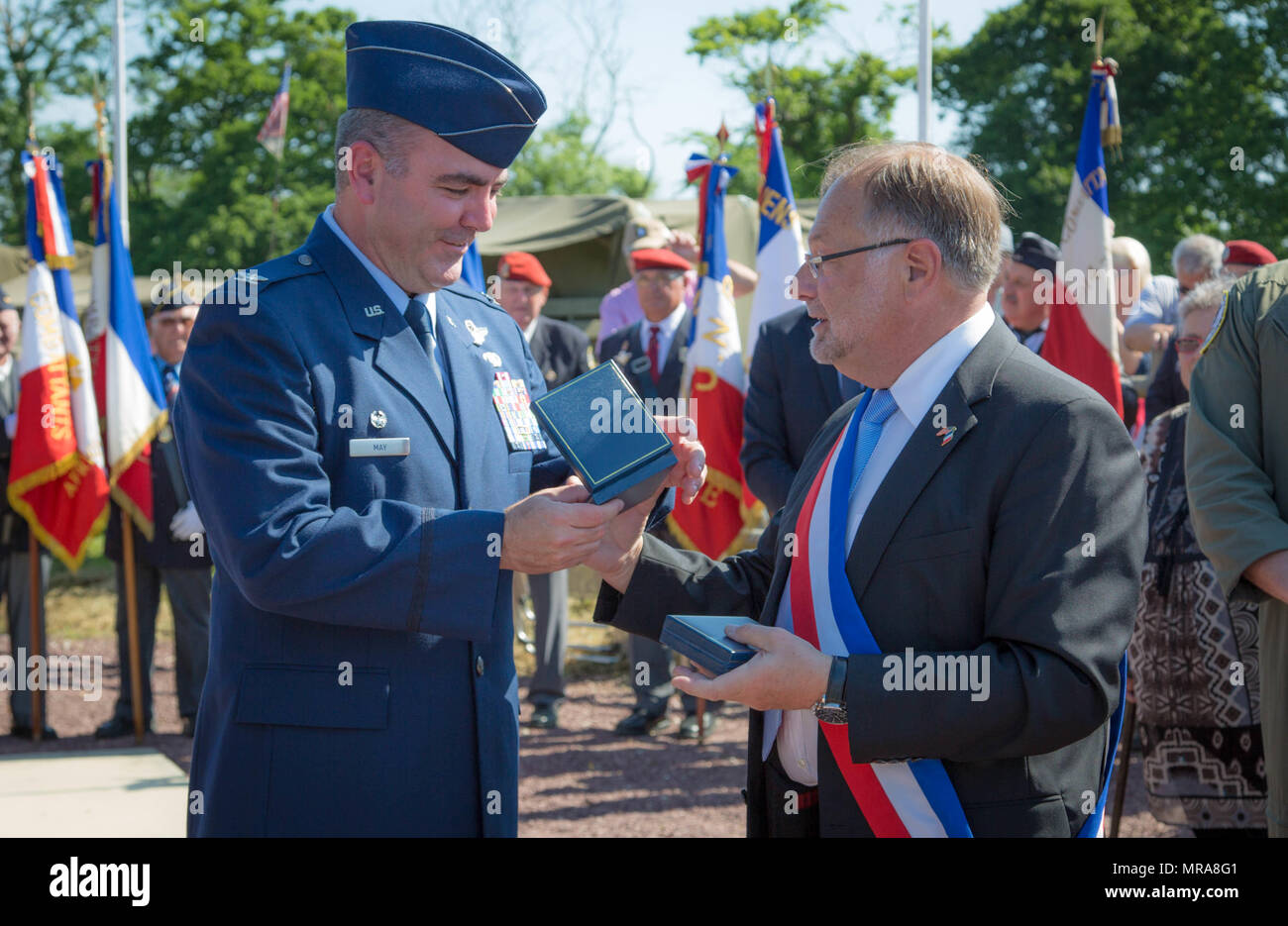 Colonel Brian May receives a special commemorative medal from the Mayor ...