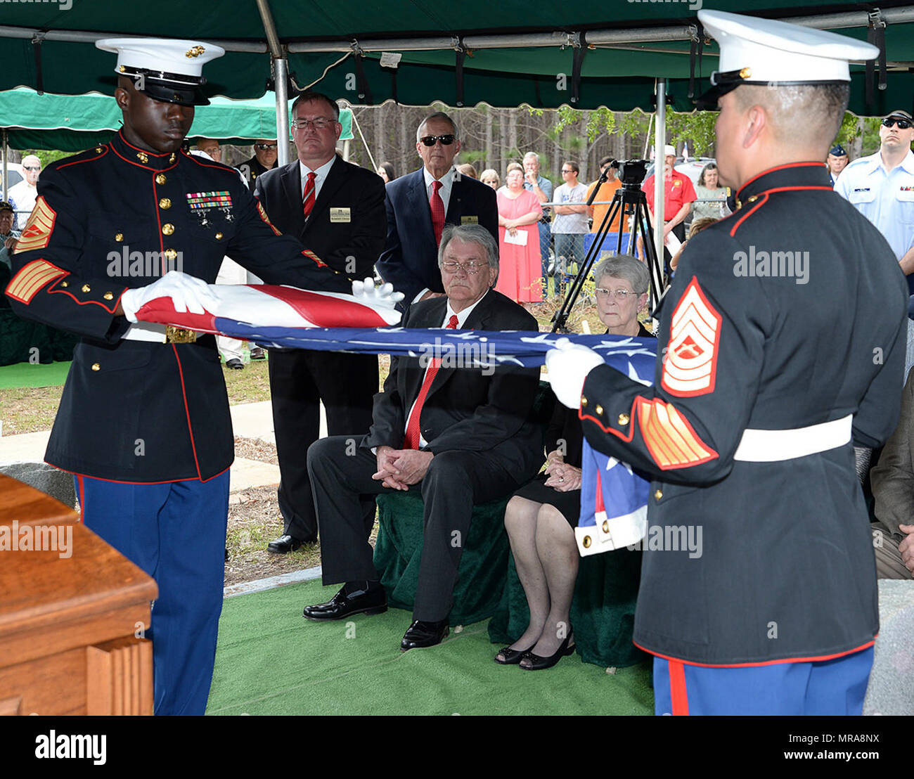 Master Sgt. Jeremy Singleton, left, and Master Sgt. Robert Nolasco fold ...