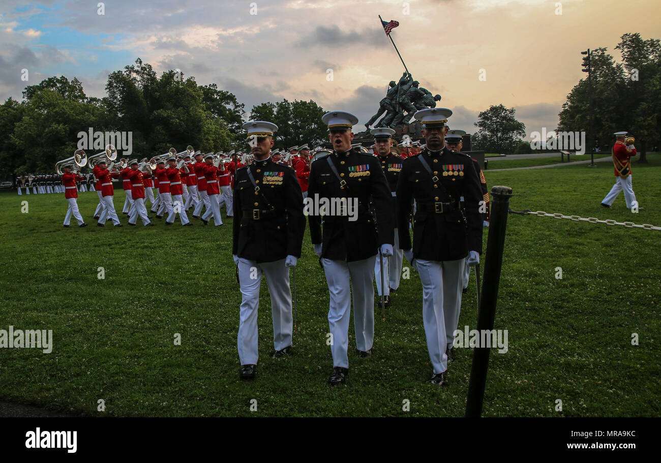 The parade staff Marines march as a part of the pass in review during a ...