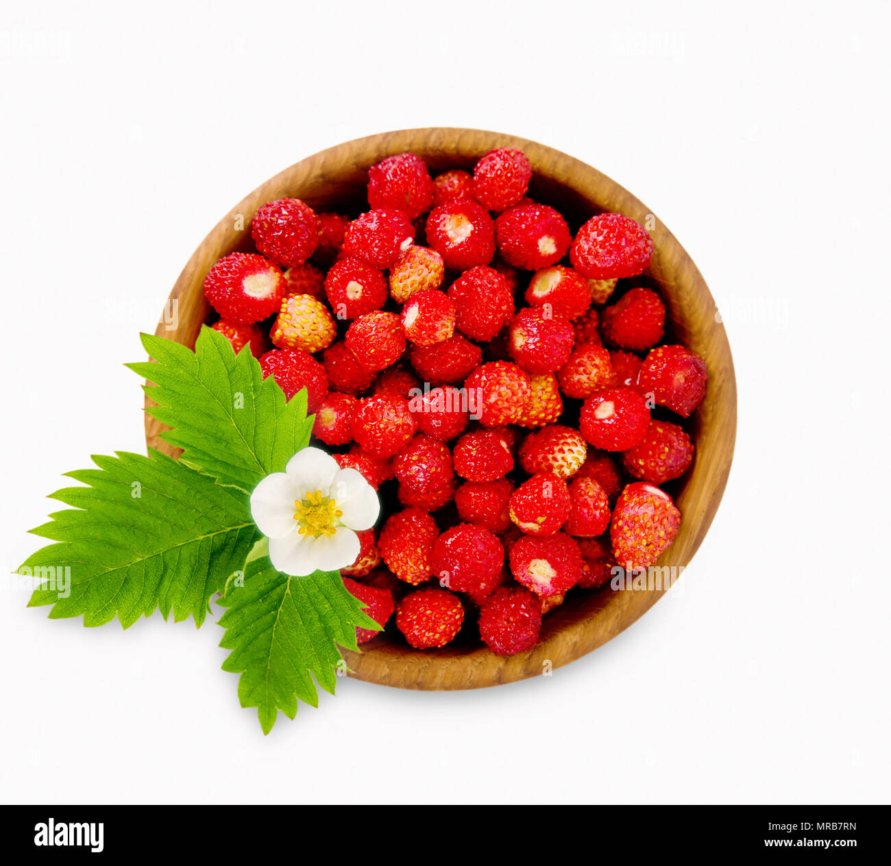 Wild small strawberry in a wooden bowl. Ripe and tasty strawberry ...