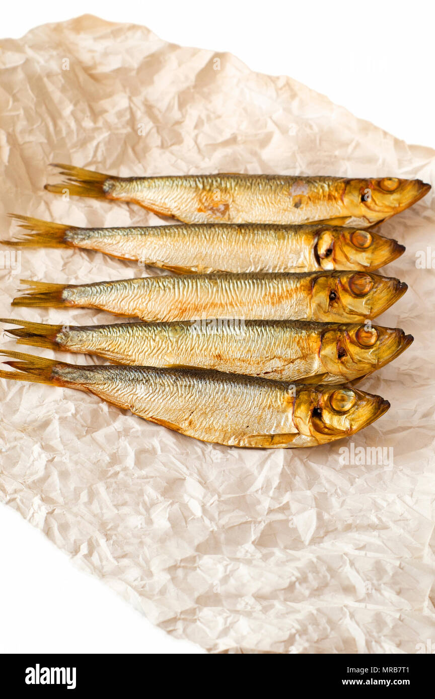 Smoked fish on a white background Stock Photo - Alamy