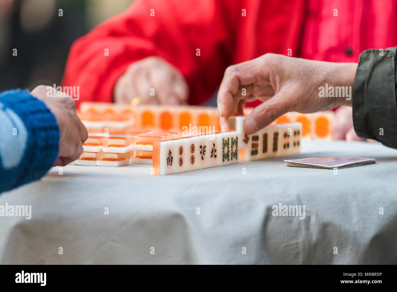 Mahjong players close up Stock Photo - Alamy