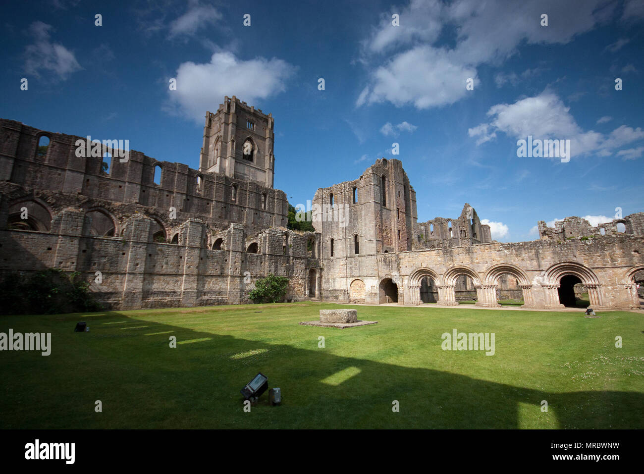 Courtyard-like interior of the monastery ruins in Fountains Abbey ...