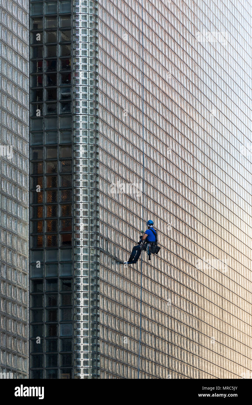 Window washer on Ginza Maison Hermès, Tokyo, Japan Stock Photo - Alamy