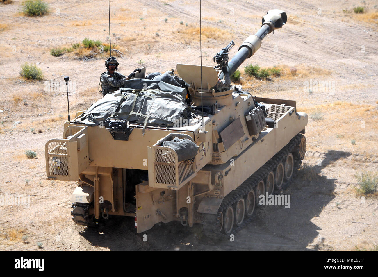 A Soldier with the 155th Armored Brigade Combat Team observes a passing ...