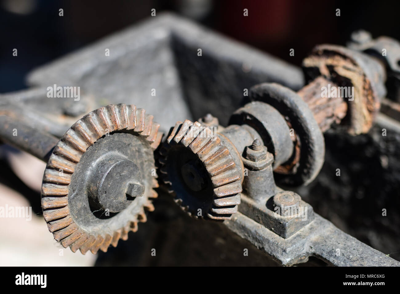 Old metal gears in drive mechanisms. Rusty gears used in machines from ...