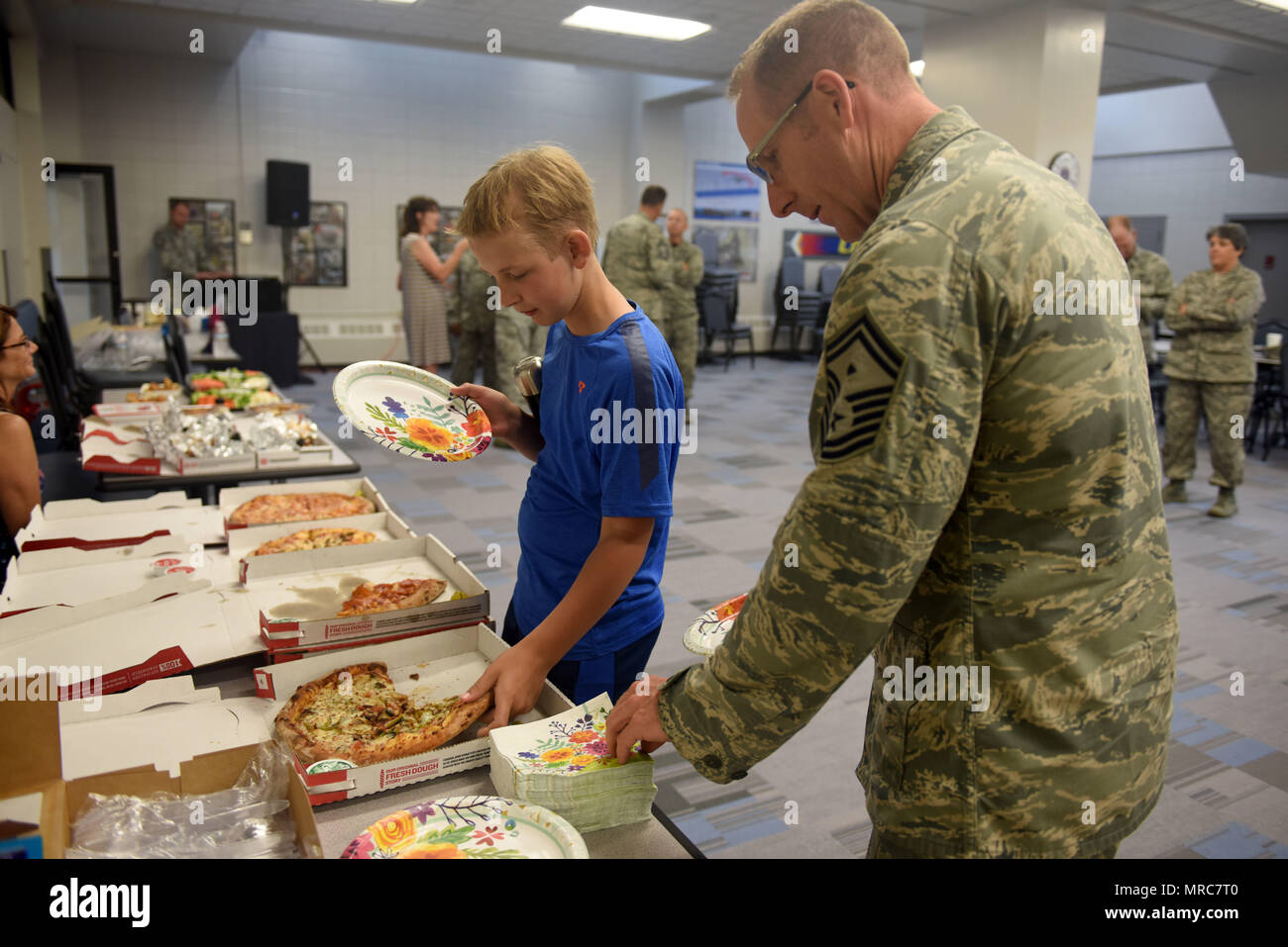 U.S. Air Force Senior Master Sgt. Almon Partain, and his son grab some ...