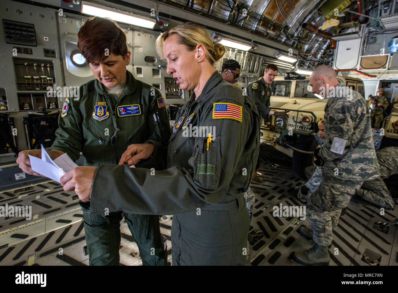 U.S. Air Force Loadmasters Master Sgt. Victoria D. Staley, left, and ...