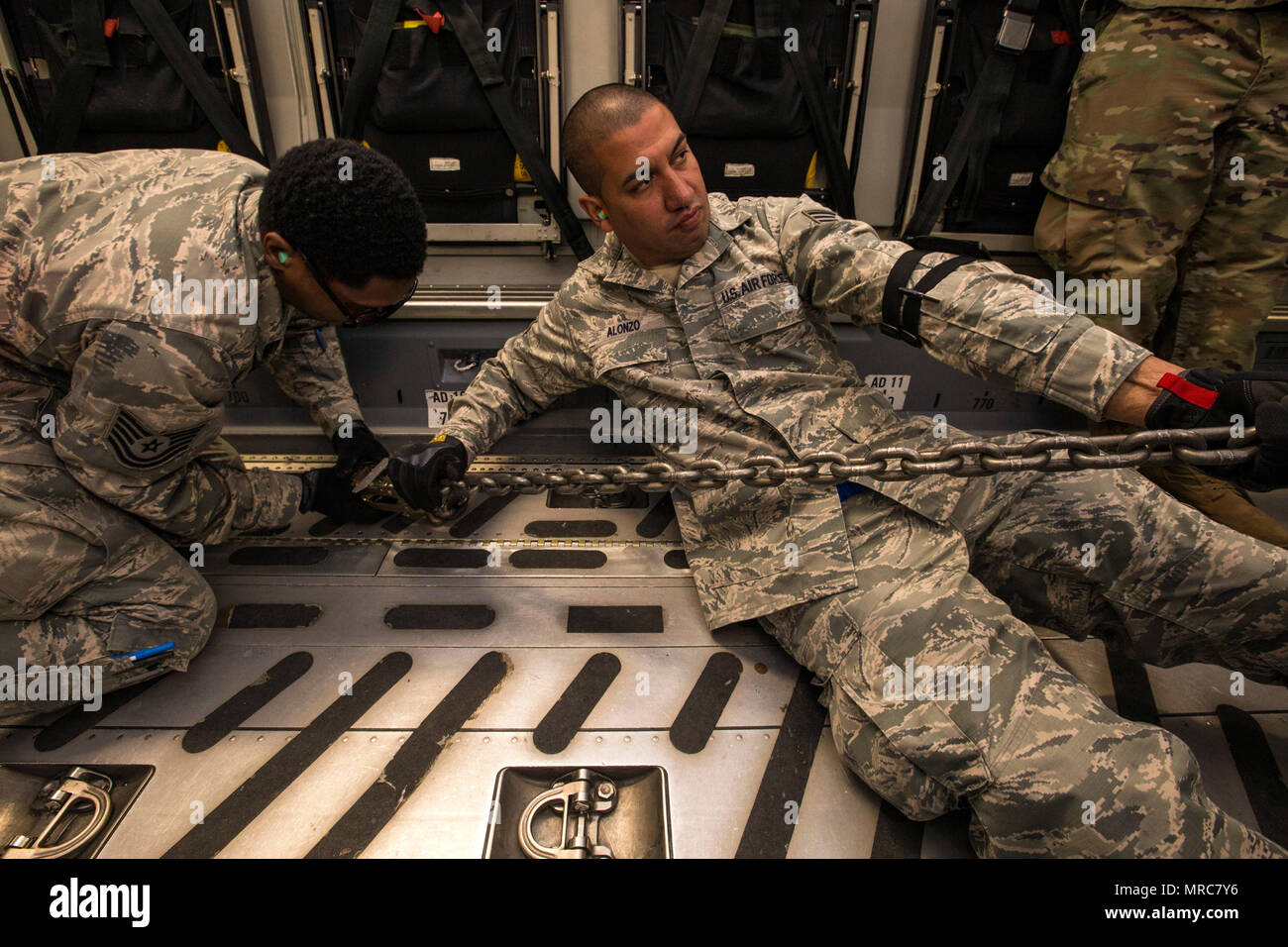 U.S. Air Force Aerial Porters Tech. Sgt. Horace A. Daughety, left, and ...