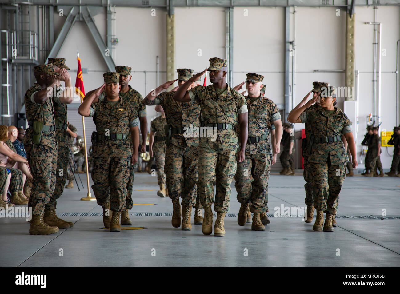 U.S. Marines with Headquarters and Headquarters Squadron (H&HS) salute ...