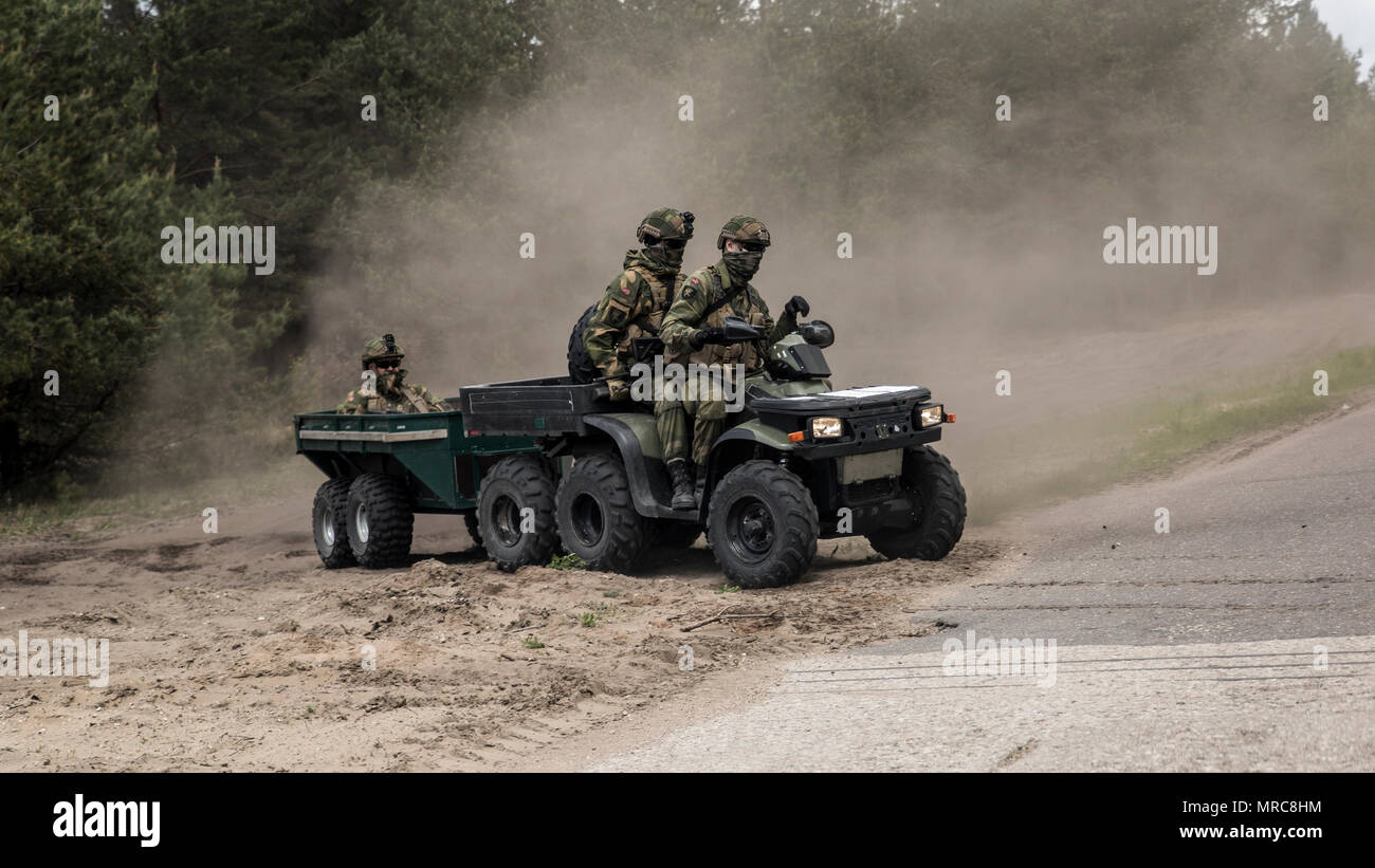 SALASPILS, Latvia-Soldiers of the Norwegian Armed Forces drive through ...