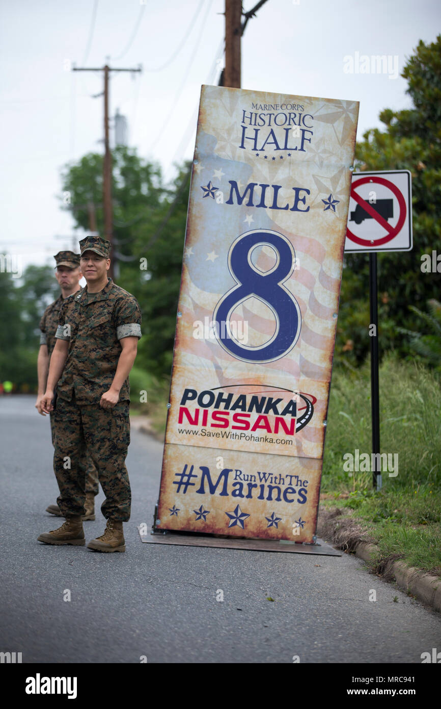 U.S. Marines cheer on the participants at the 8-mile marker during the ...