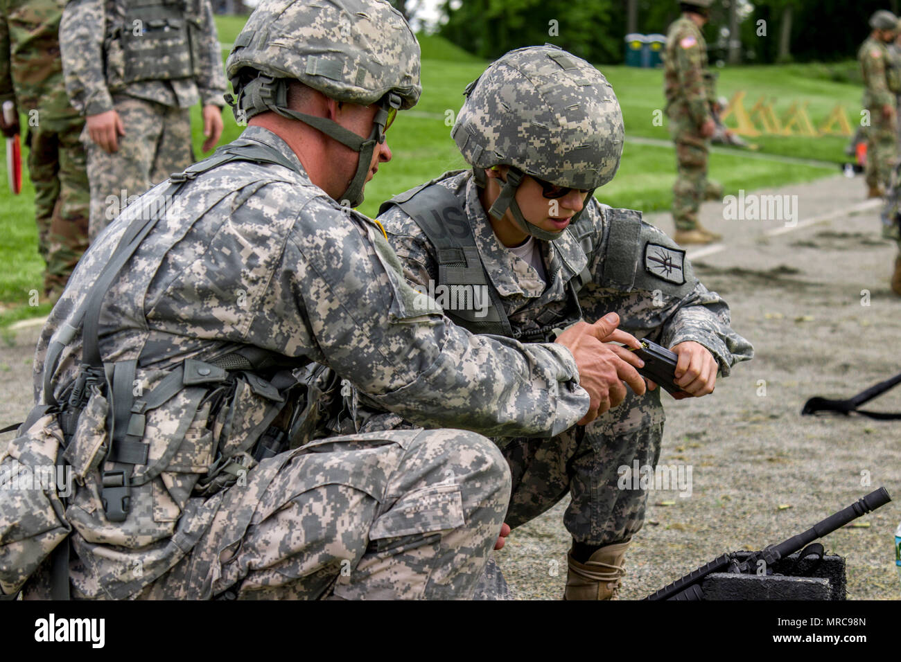 U.S. Army Spc. Michael Burton and Sgt. Janna Enyart, with the 53rd ...