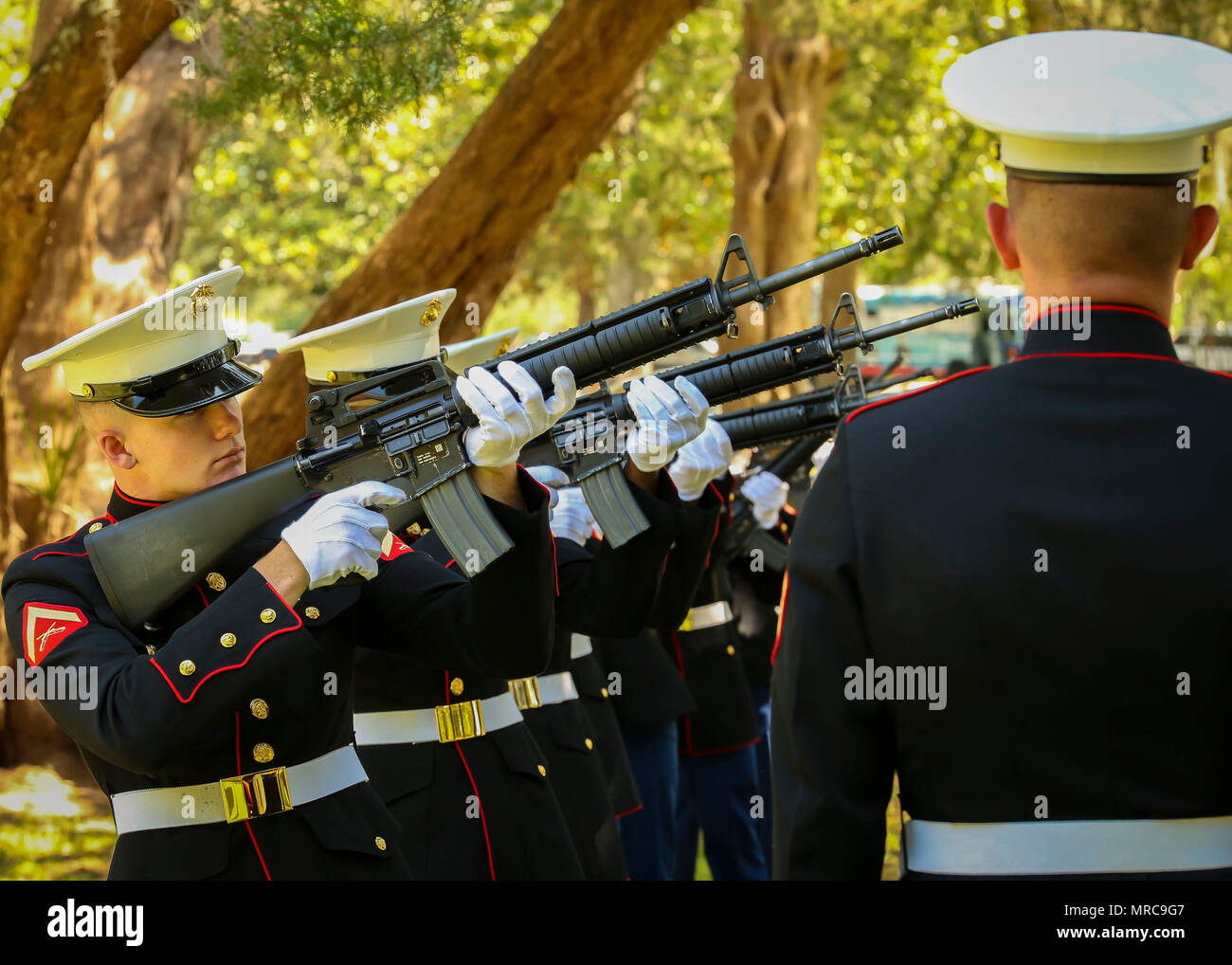 A Marine Corps rifle squad prepares to fire during the Memorial Day ...