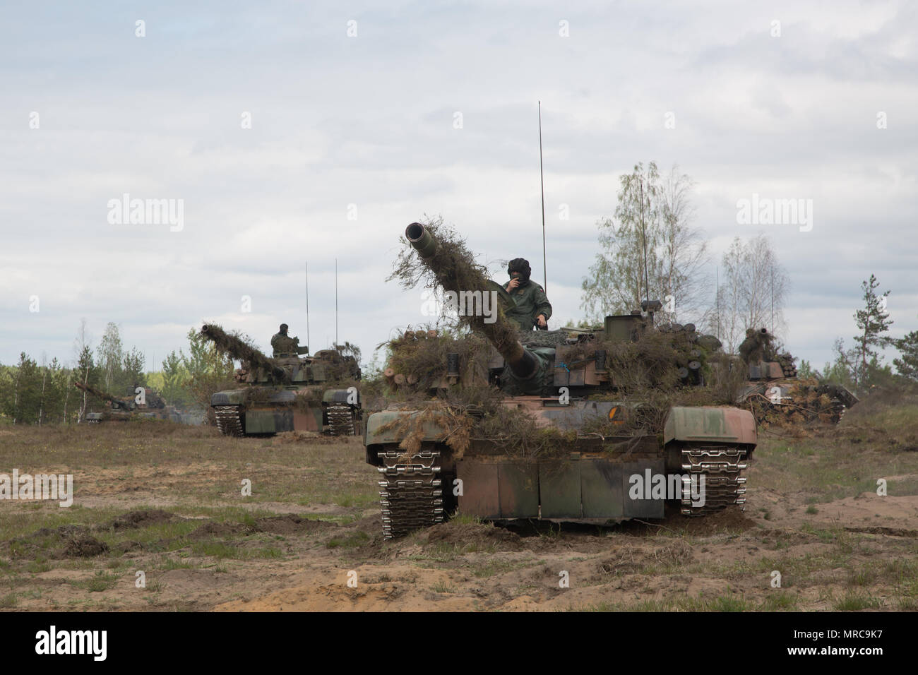 Polish soldiers operate PT-91 Twardy tanks during Saber Strike 17 at ...