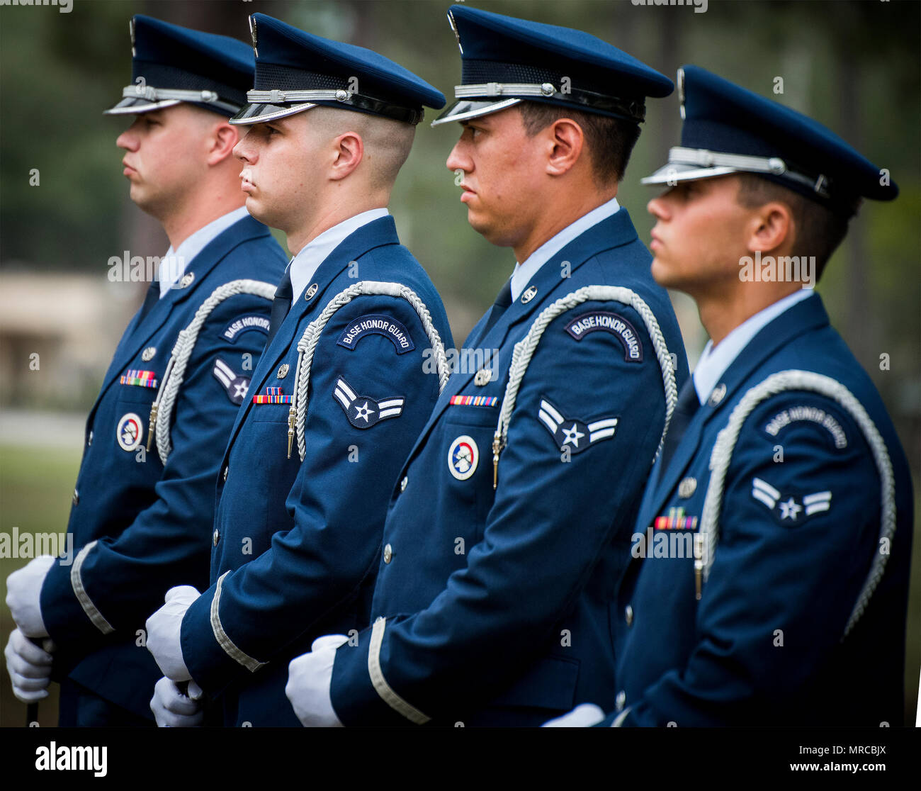 Rifle-bearing Airmen stand at parade rest prior to the Team Eglin Honor ...