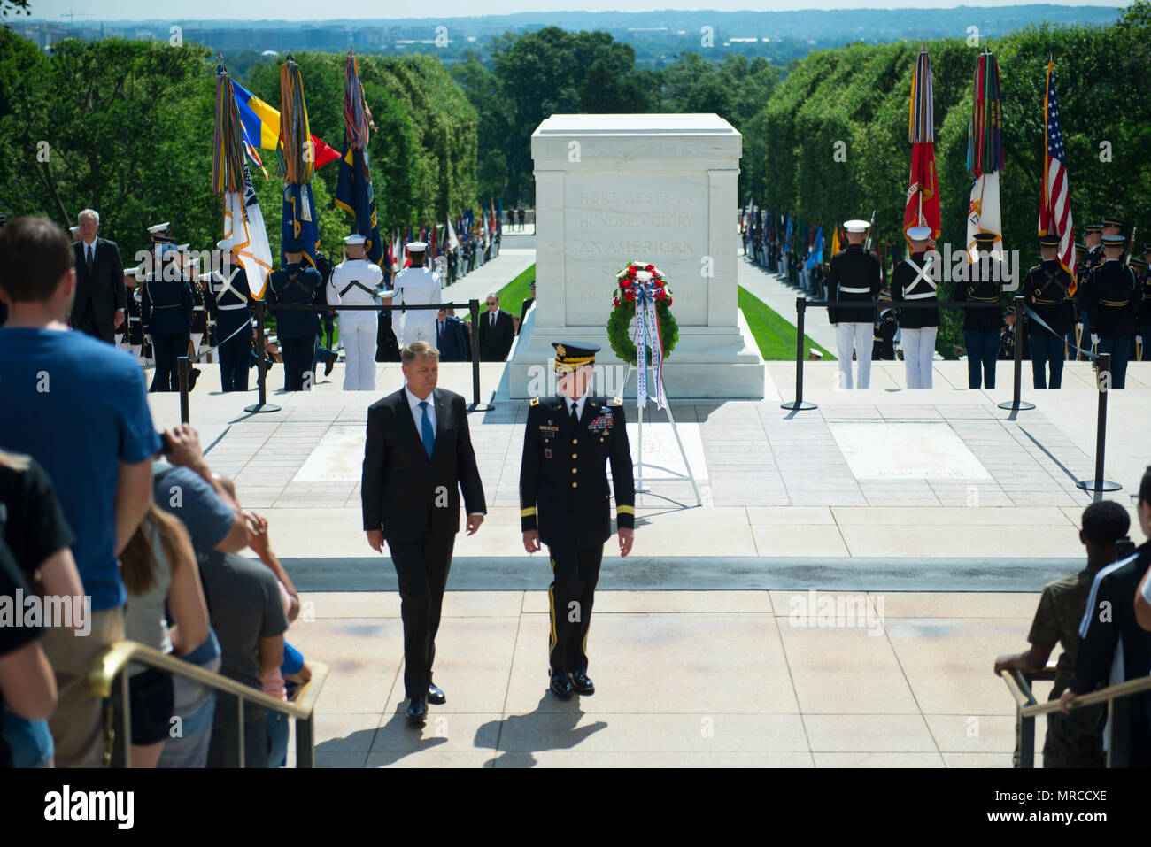 Klaus Iohannis (left), President of Romania, is escorted by Maj. Gen ...