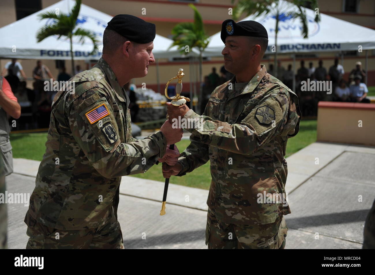 Col. Guy D. Bass, Fort Buchanan Garrison Commander , presents the ...