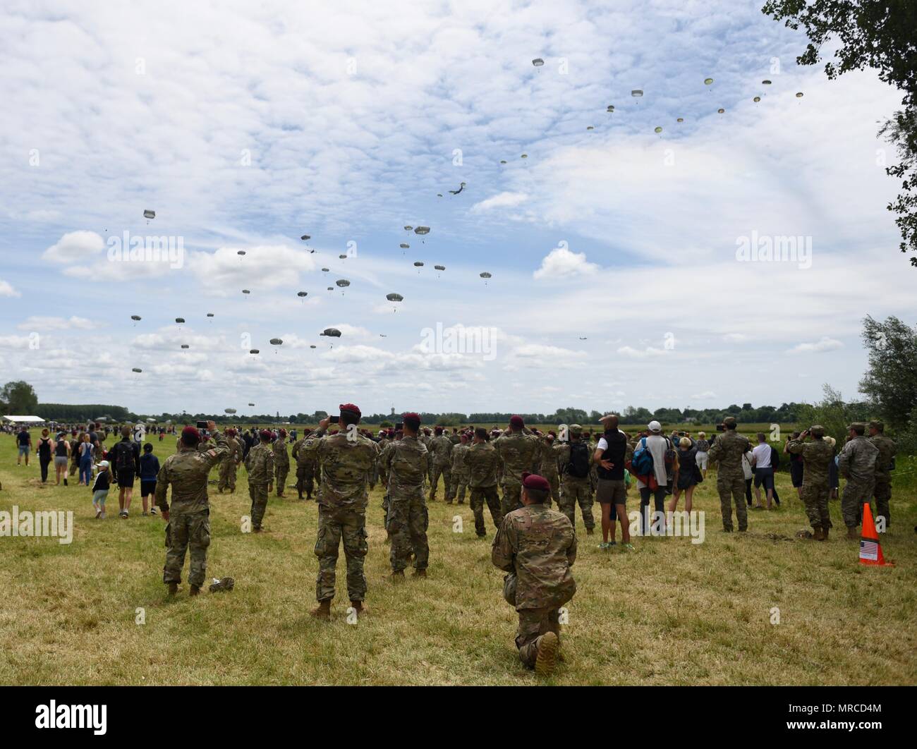 U.S. Army Paratroopers watch the airborne operation on Iron Mike II ...