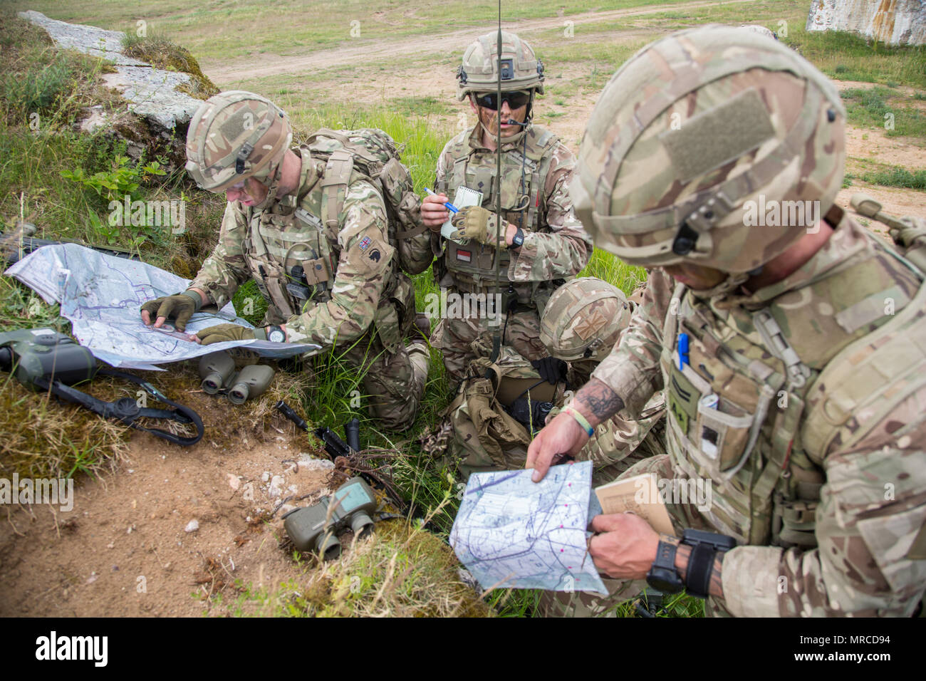 British soldiers review maps to update coordinates and locate their ...