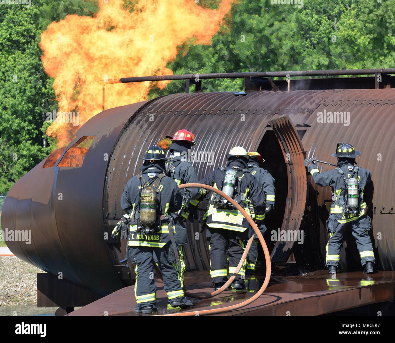 (Left to right) Firefighters, Anthony Holthaus, Matthew Smith, Bryan ...