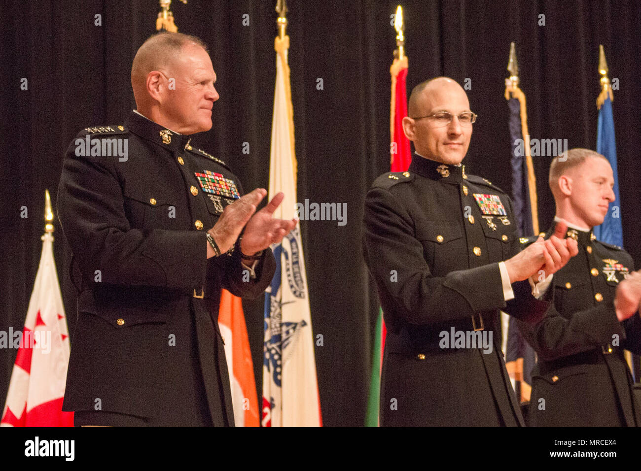Commandant of the Marine Corps Gen. Robert B. Neller shakes hands with ...