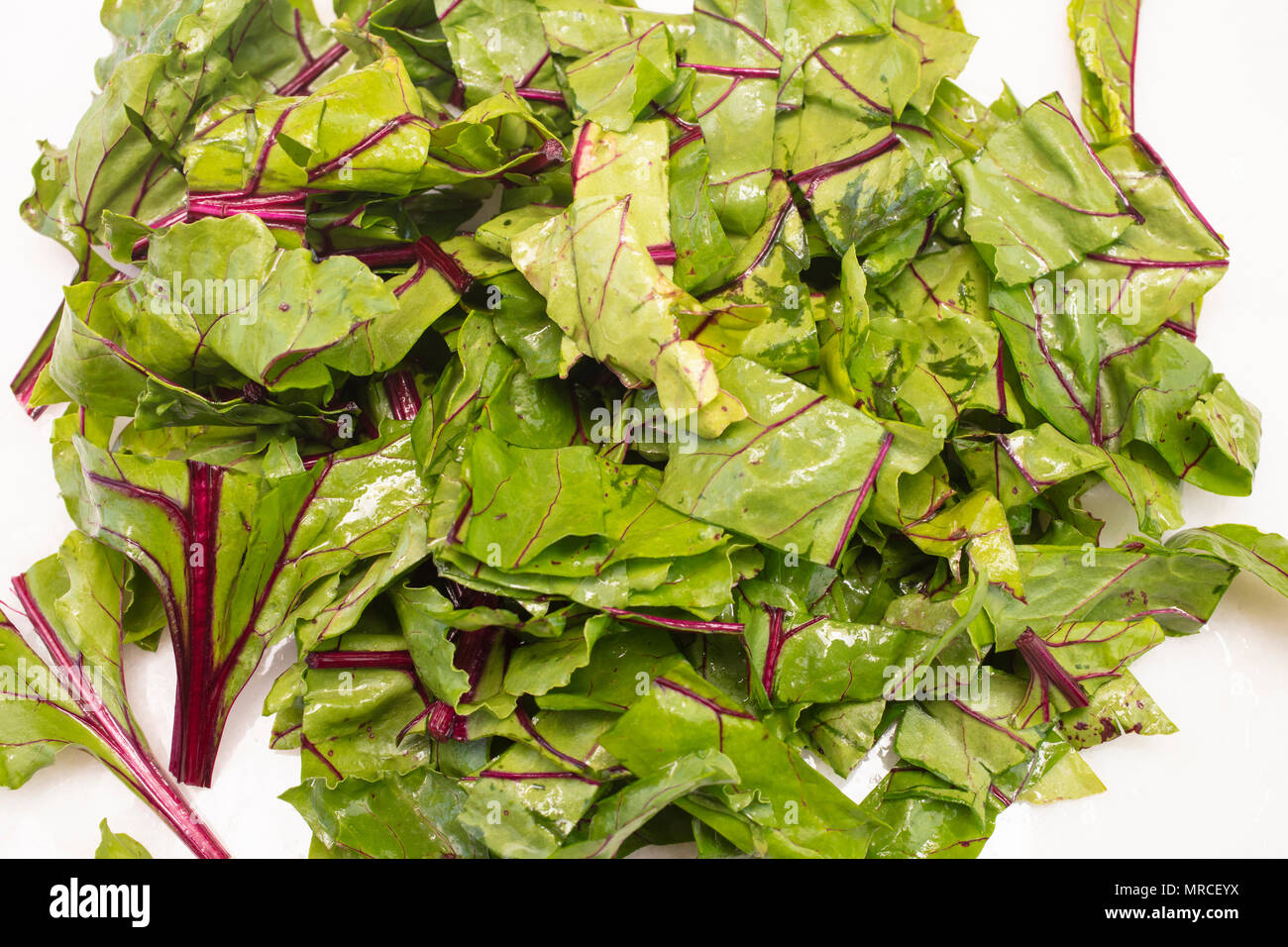 Fresh chopped beet leaves cut up for a recipe Stock Photo - Alamy