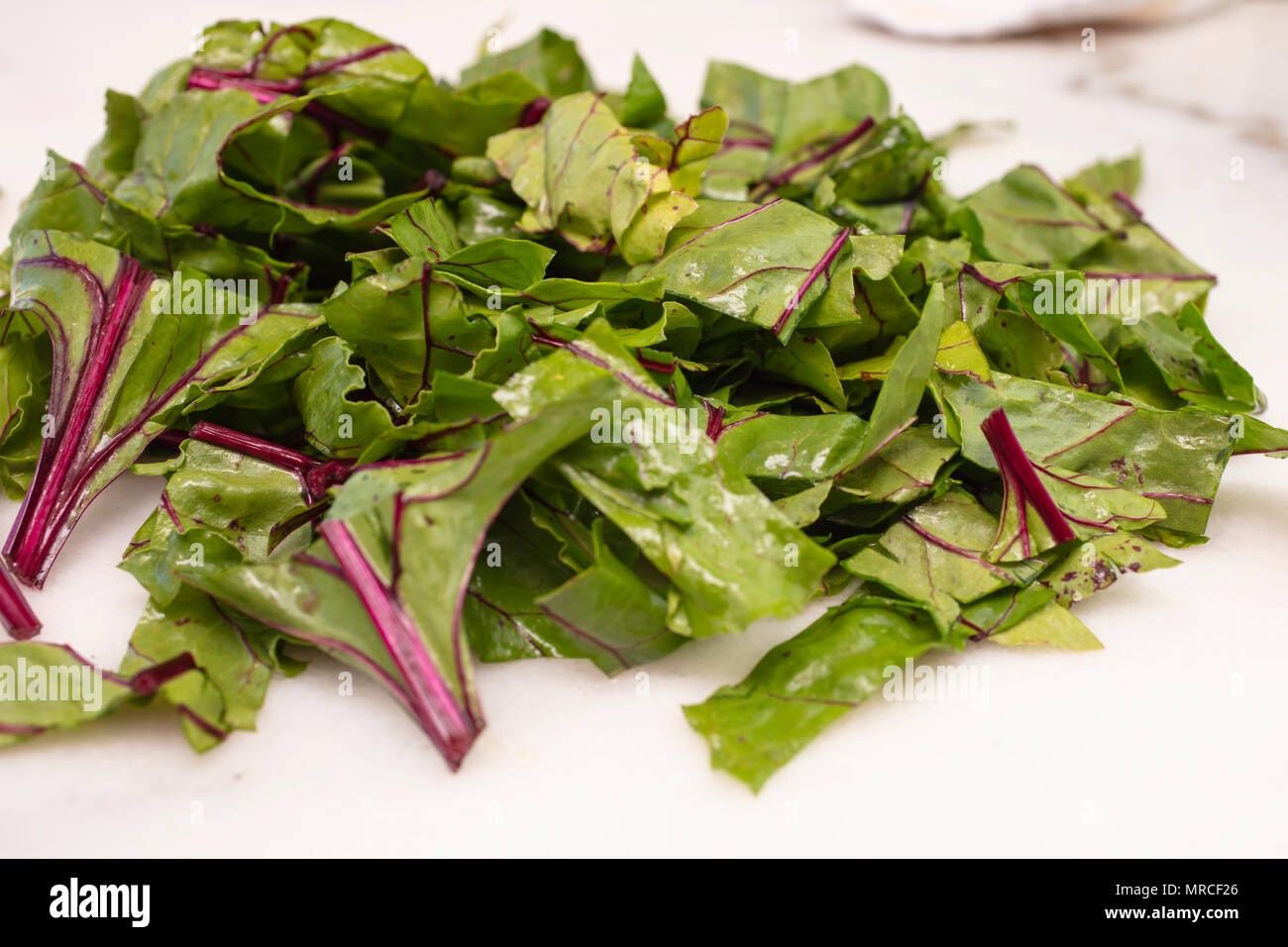 Fresh chopped beet leaves cut up for a recipe Stock Photo - Alamy