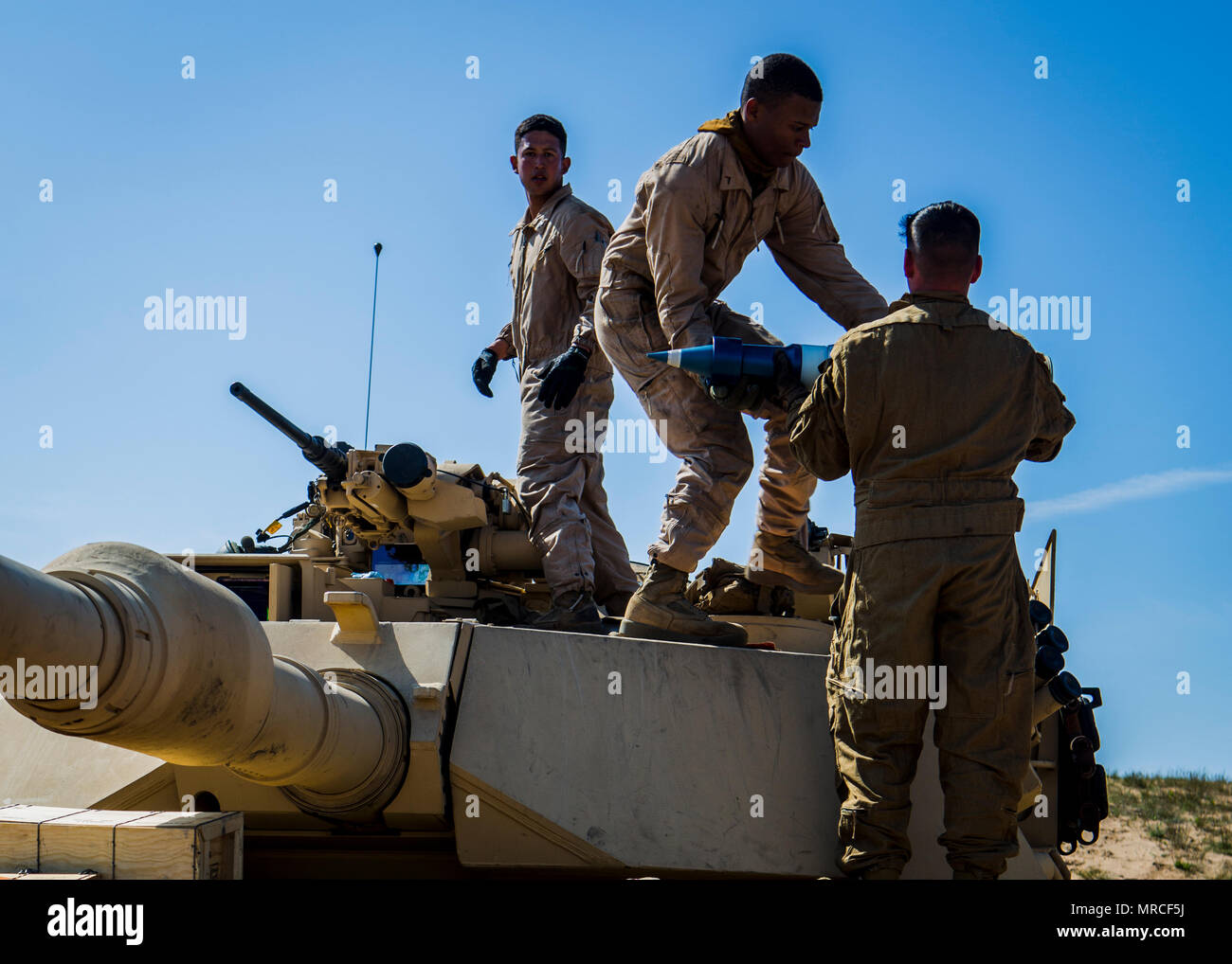 U.S. Marines with 4th Tank Battalion prepare ammunition before a tank ...