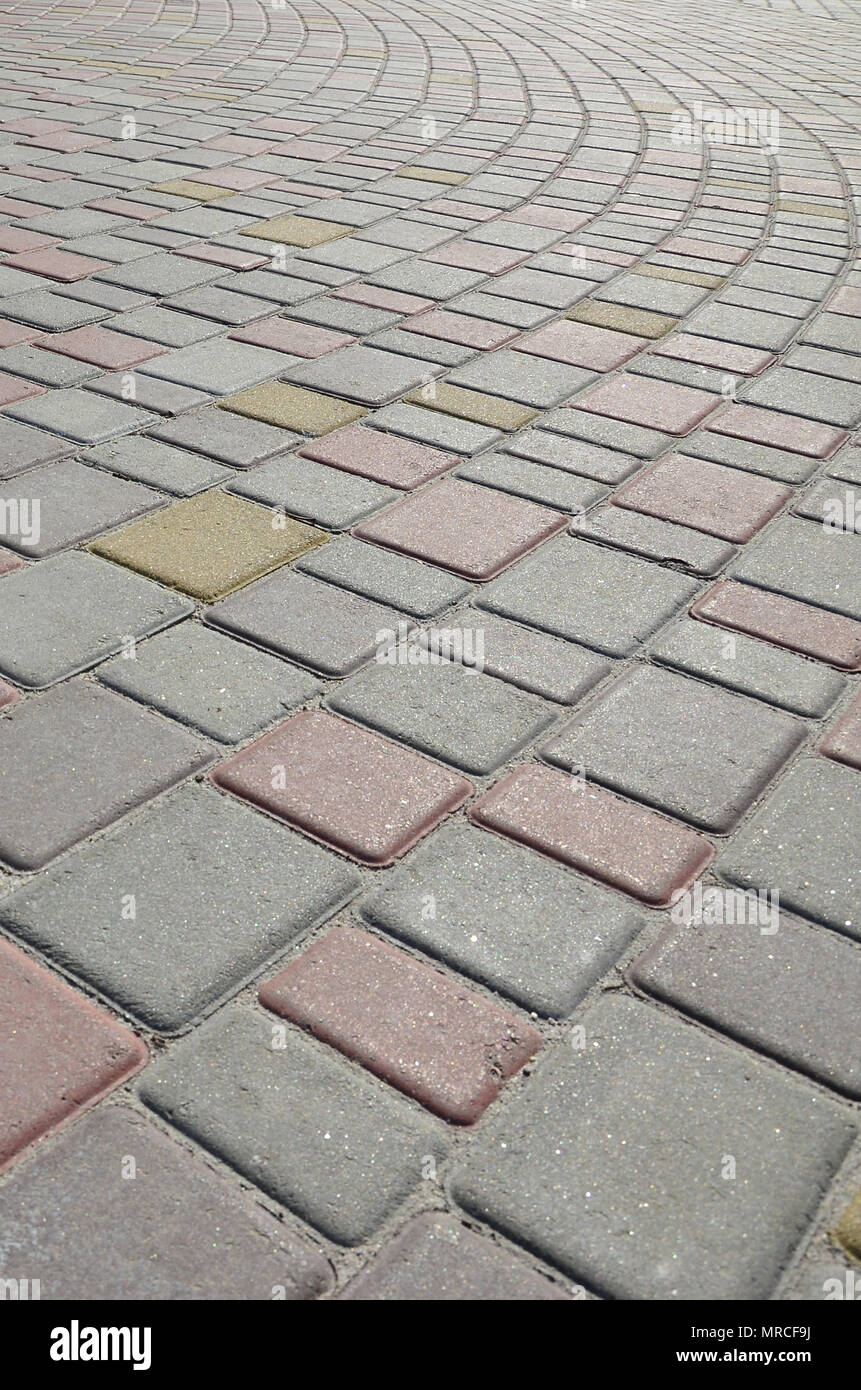 A large area, laid out of paving stone in perspective. Detailed photo ...