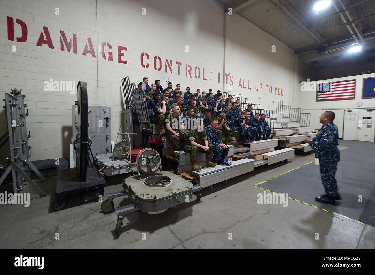 Chief damage controlman daniel lagunas explains the wet trainer hi-res ...