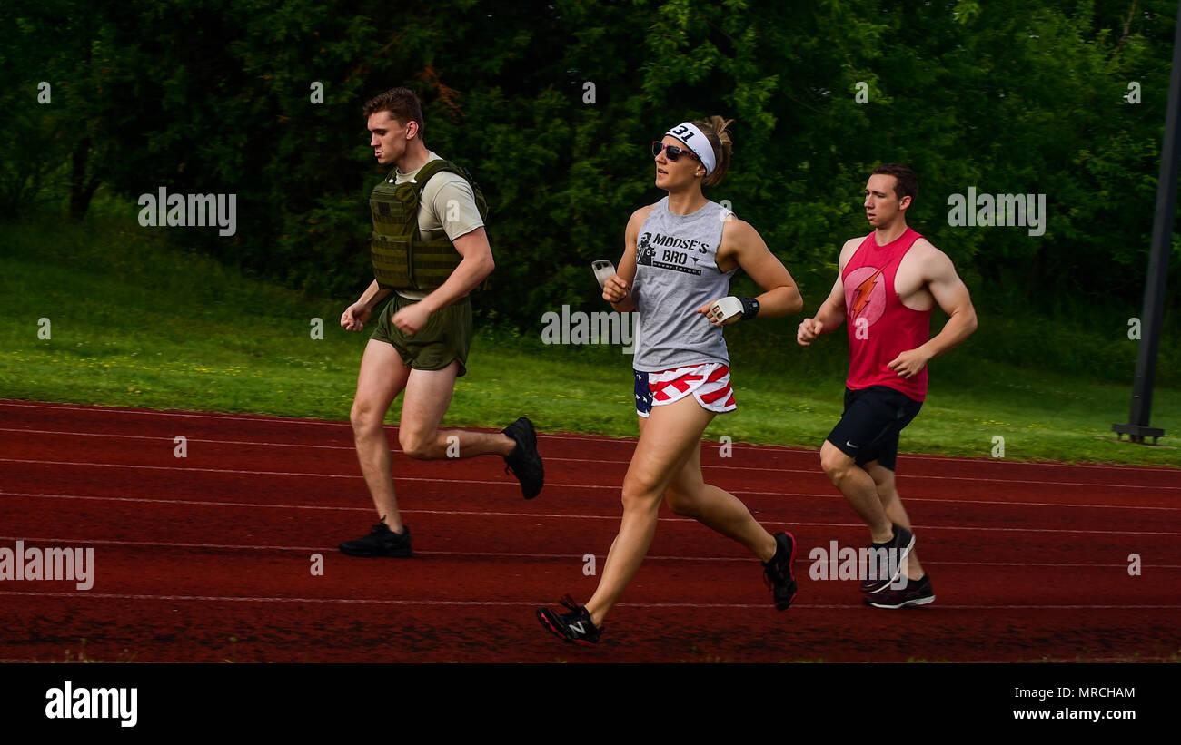 U.S. service members and their families participate in a 1-mile run ...