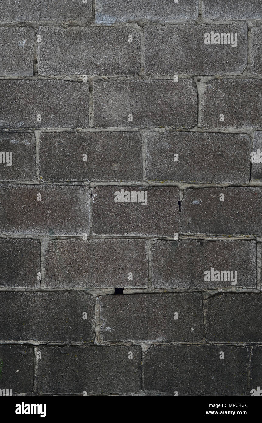 Weathered stained old block wall background. Texture of an old wall of ...