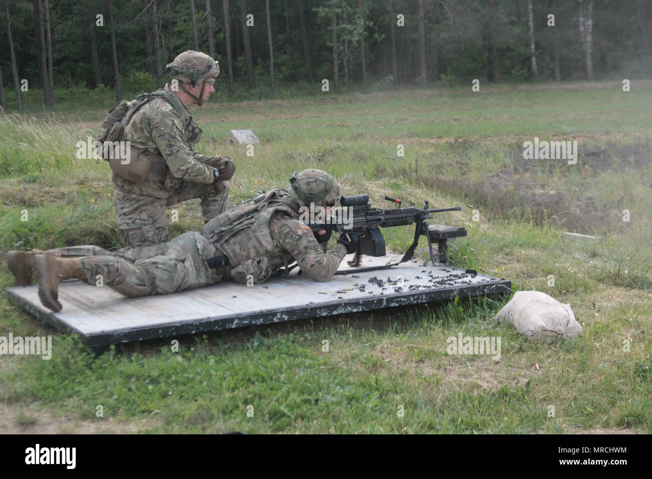 A Battle Group Poland U.S. Soldier fires his 240 Lima 7.62 mm automatic ...