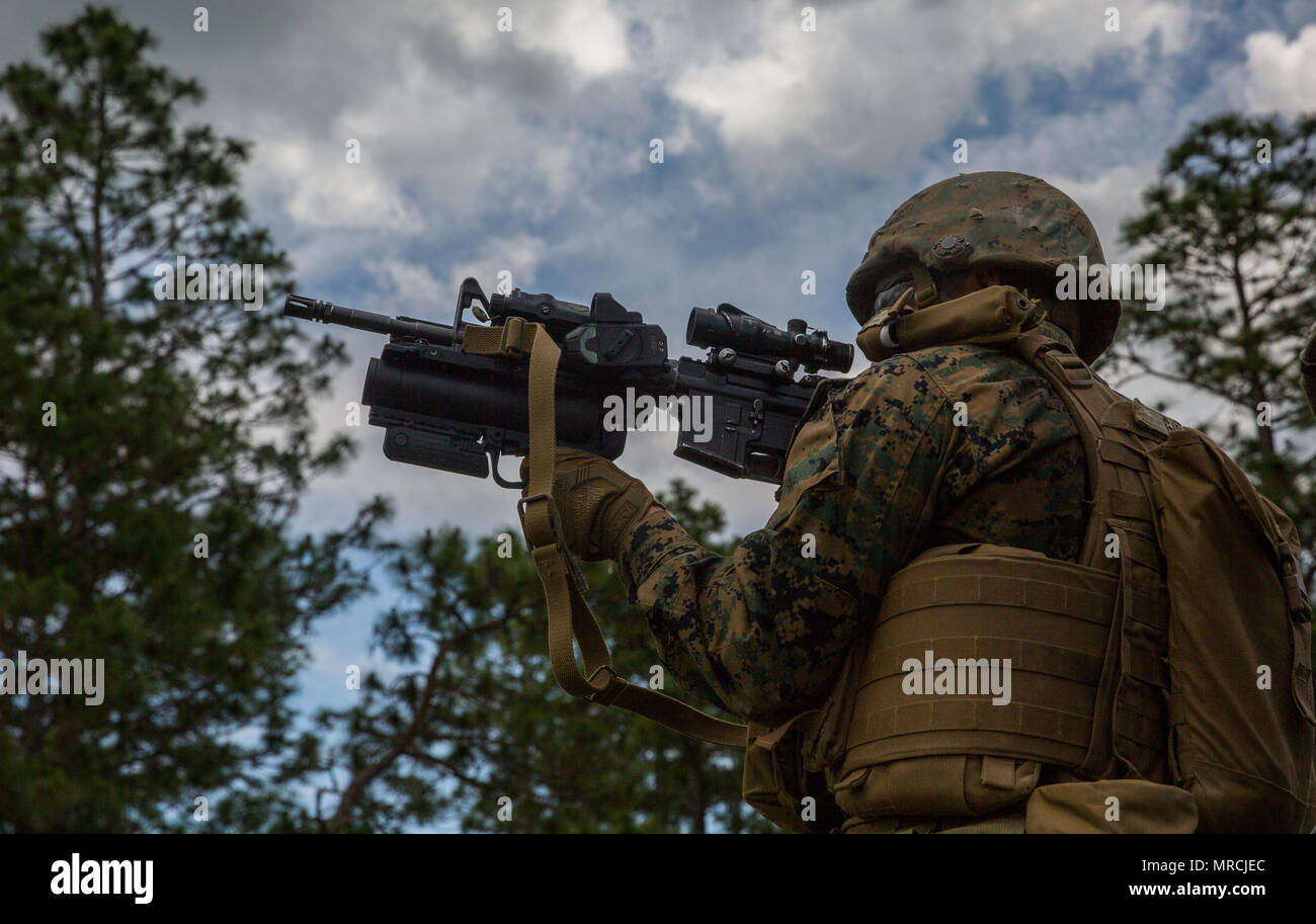A Marine prepares to shoot an M320 mounted on an M4 rifle at Camp Lejeune, N.C., June 6, 2017 ...